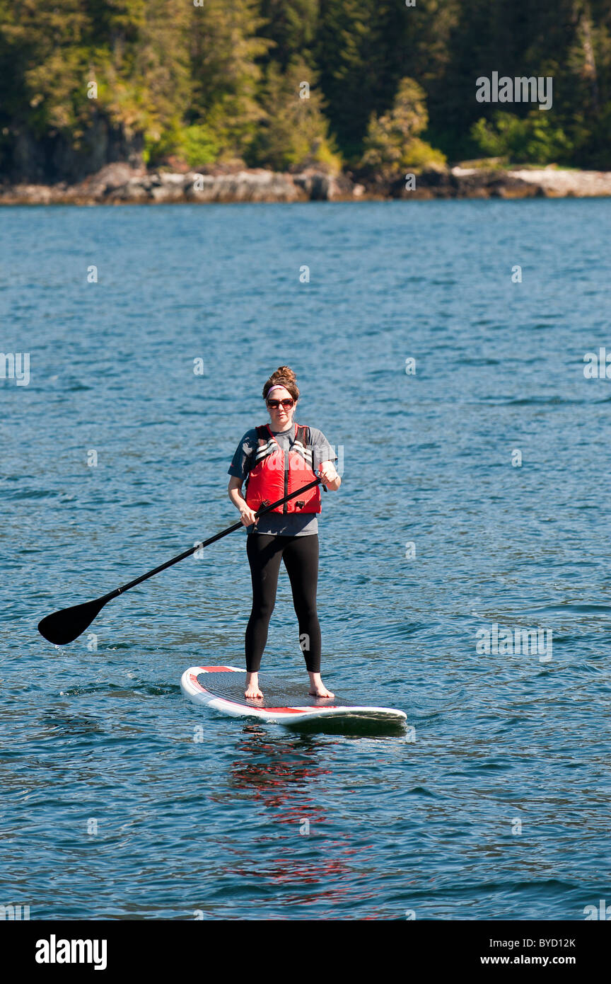 Young woman paddleboarder paddleboarding in Windham Bay in the Chuck ...