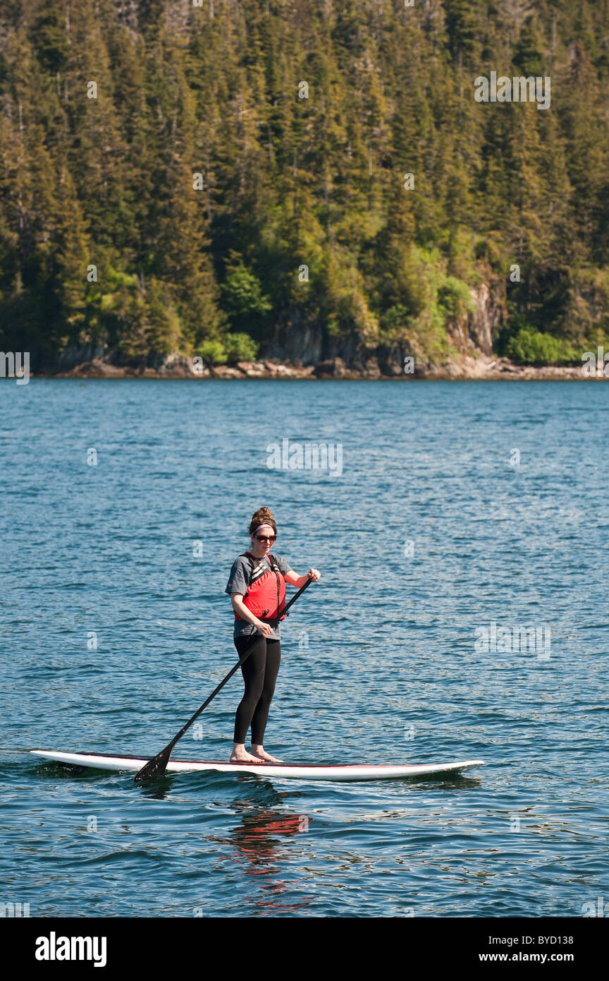 Young woman paddleboarder paddleboarding in Windham Bay in the Chuck ...