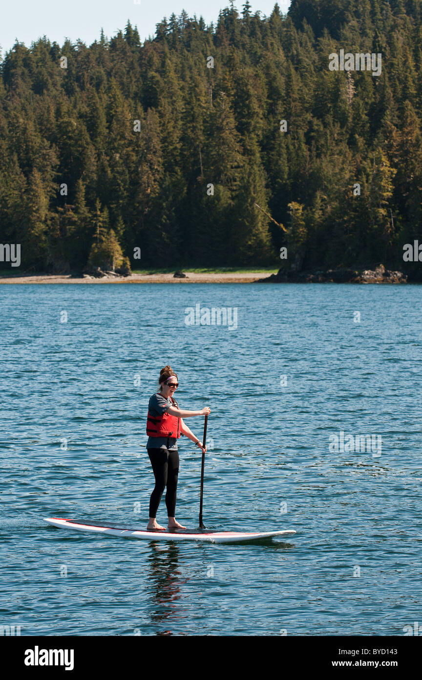 Young woman paddleboarder paddleboarding in Windham Bay in the Chuck ...