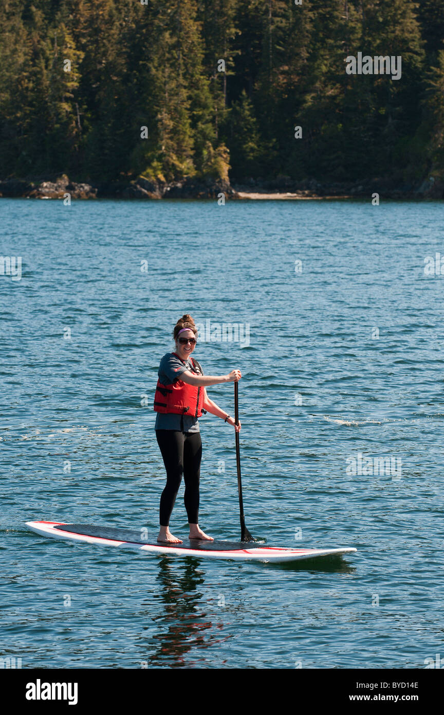 Young woman paddleboarder paddleboarding in Windham Bay in the Chuck ...