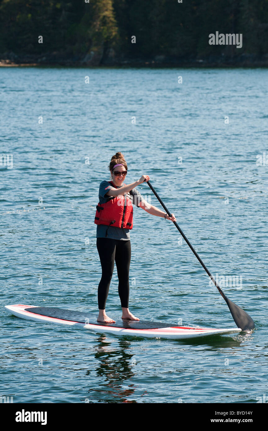 Young woman paddleboarder paddleboarding in Windham Bay in the Chuck ...