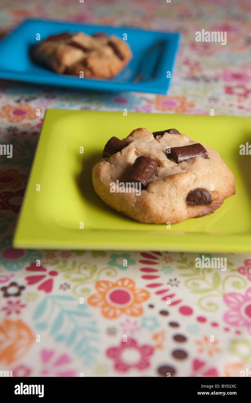 chocolate chip cookies on colorful plates Stock Photo - Alamy