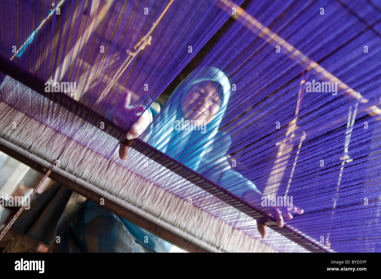 Weaver woman working with smile on her face Stock Photo - Alamy