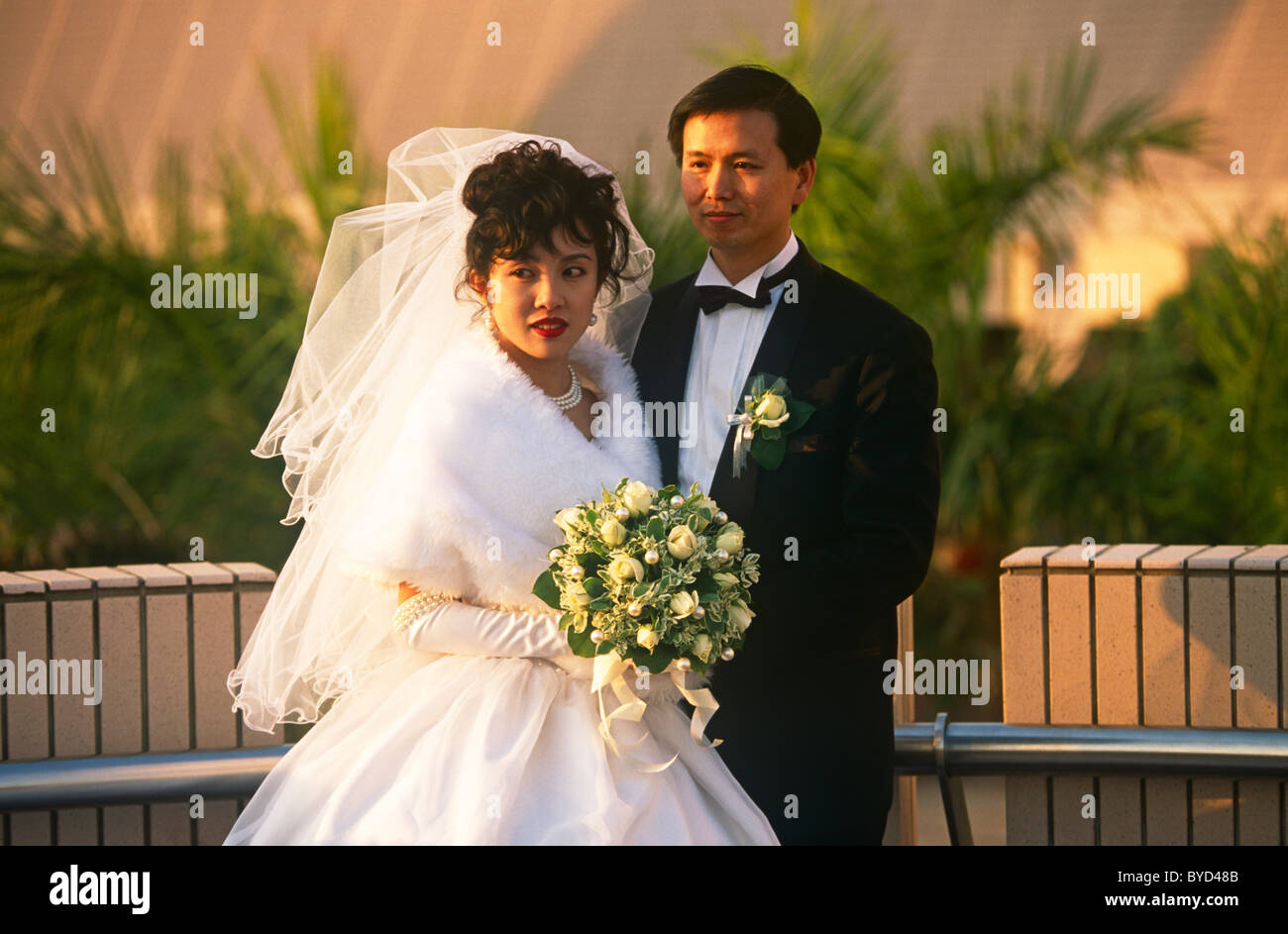 Following their wedding a Chinese bride and groom pose for personal ...