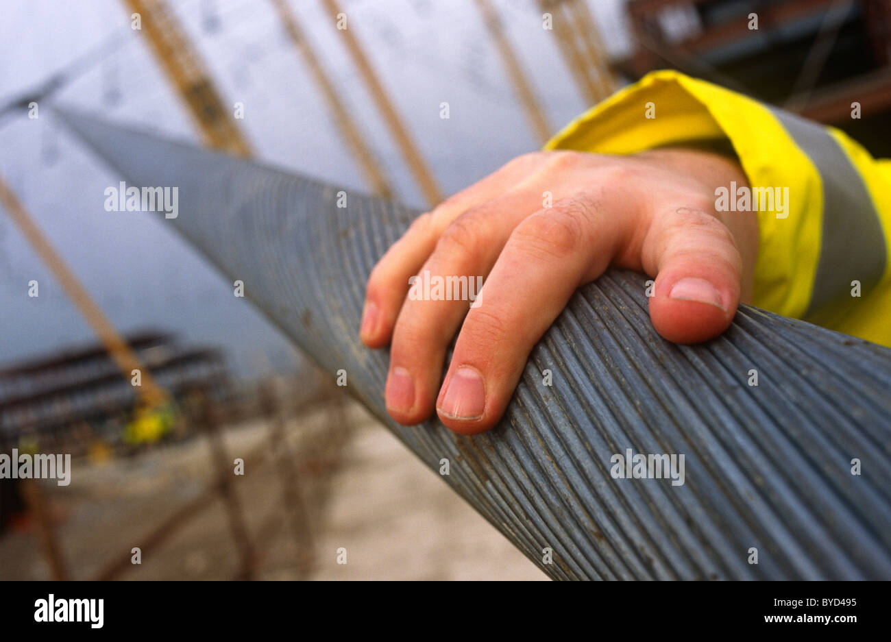 Detail of a hand resting on a strong, wide cable strut during ...