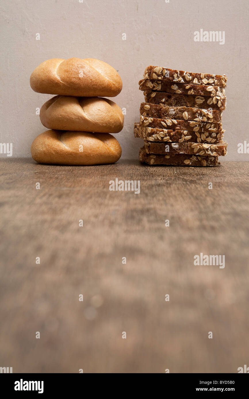 Stacks of bread rolls and sliced bread Stock Photo - Alamy