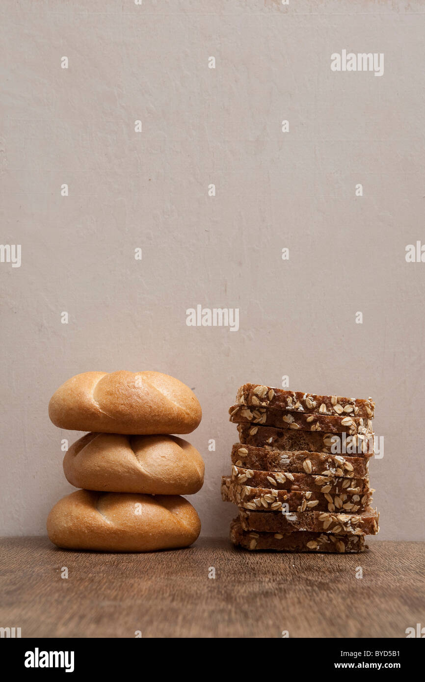 Stacks of bread rolls and sliced bread Stock Photo - Alamy