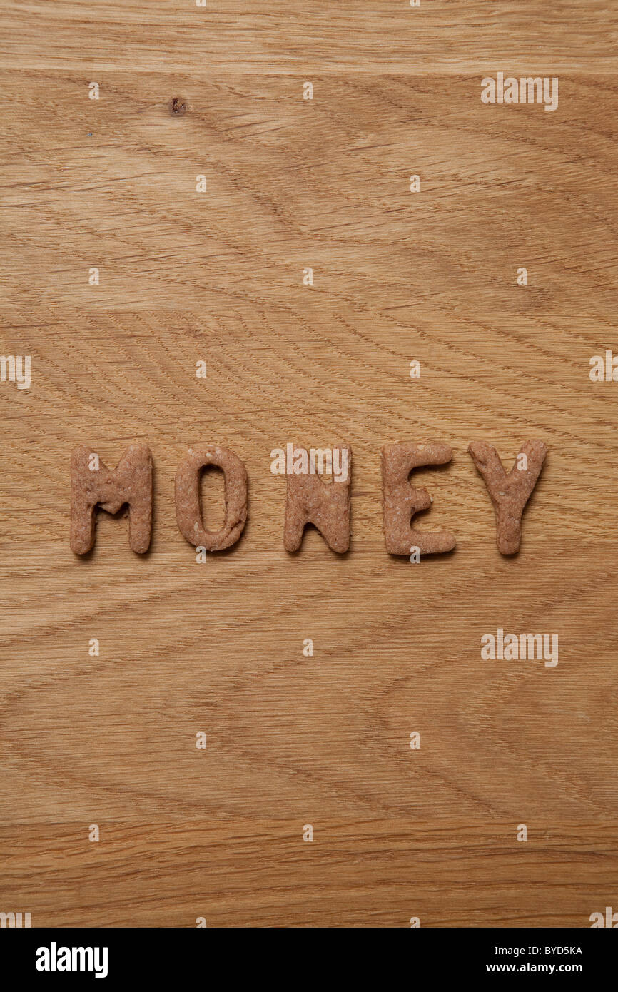 Money, word written with biscuits Stock Photo - Alamy