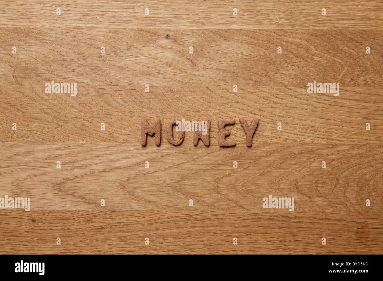 Money, word written with biscuits Stock Photo - Alamy