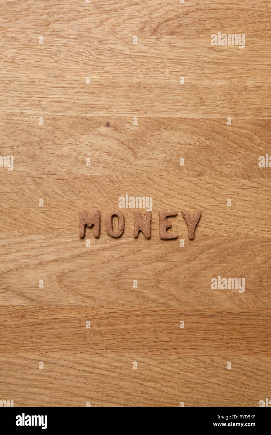 Money, word written with biscuits Stock Photo - Alamy