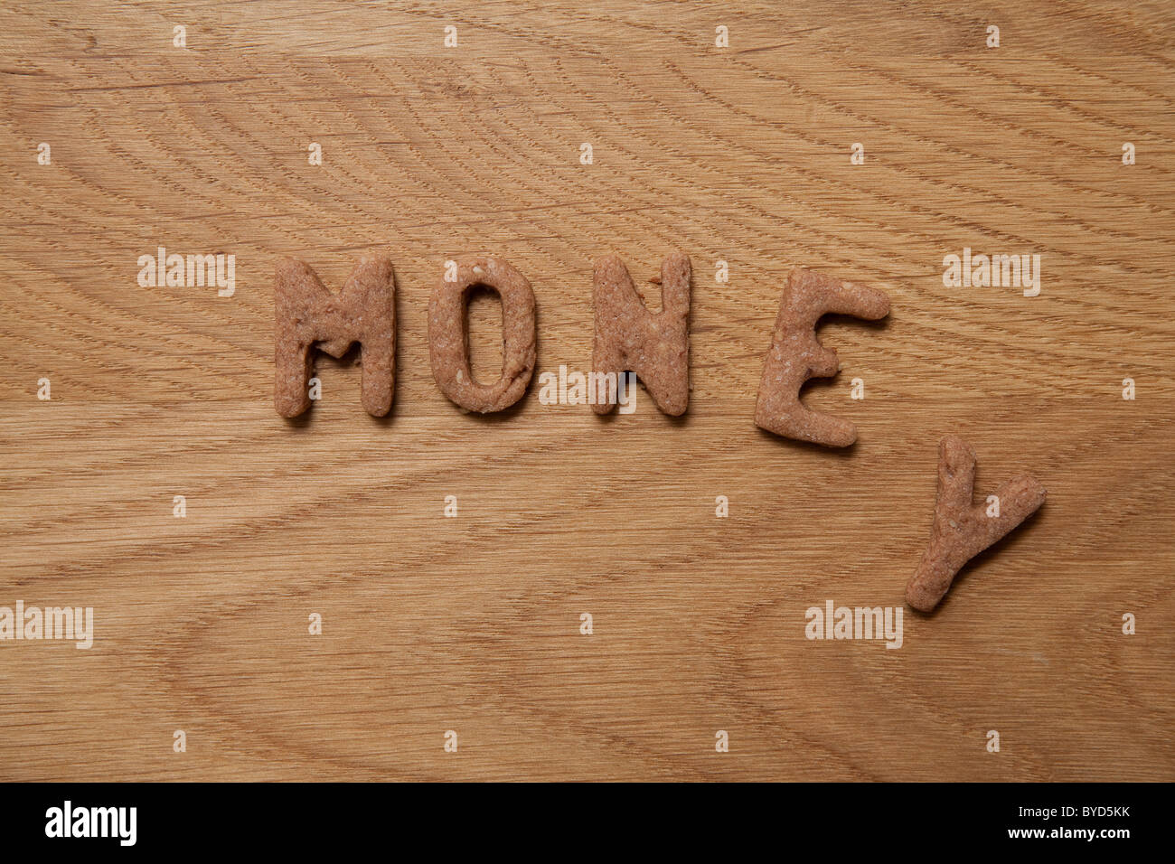 Money, word written with biscuits Stock Photo - Alamy