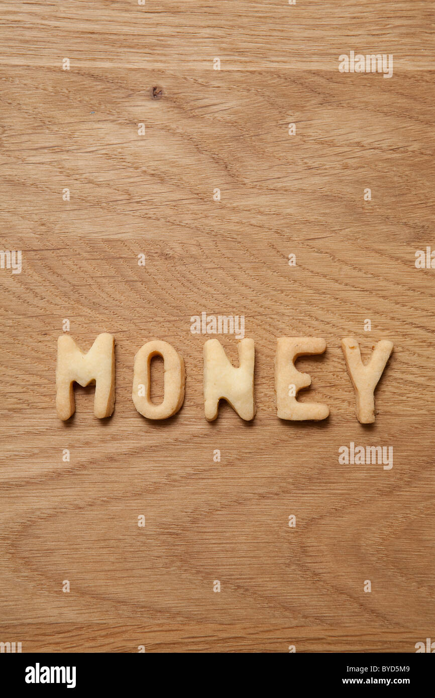 Money, word written with biscuits Stock Photo - Alamy