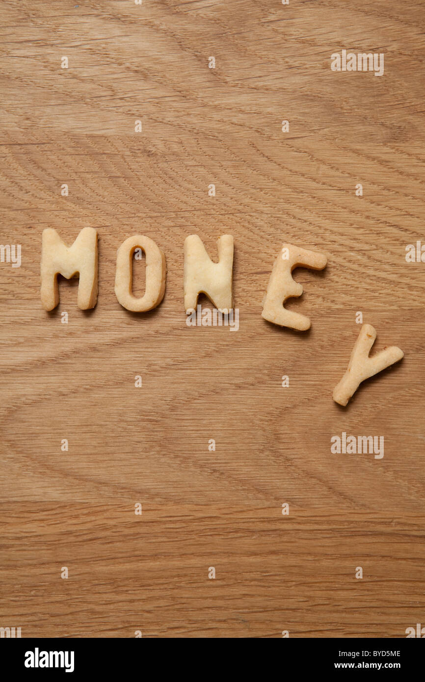 Money, word written with biscuits Stock Photo - Alamy