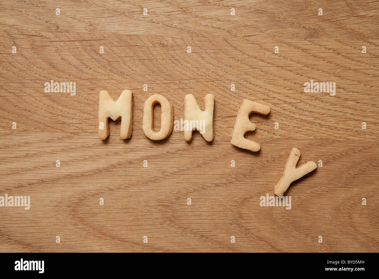 Money, word written with biscuits Stock Photo - Alamy