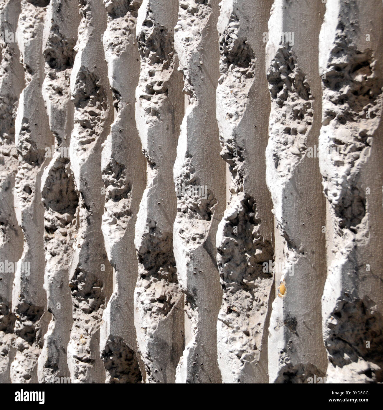 White vertical corrugated texture in precast concrete building wall ...