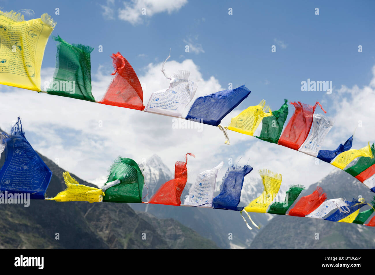 Tibetan Buddhism, colorful prayer flags blowing in the wind in front of ...