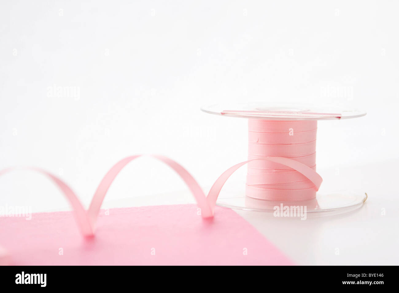Pink gift ribbon Stock Photo - Alamy