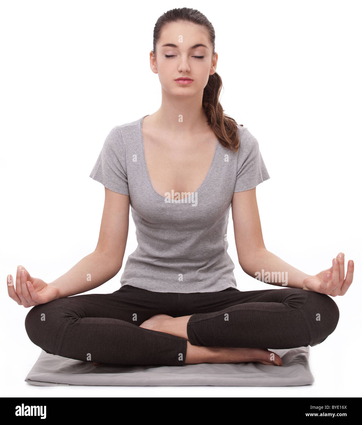 Girl practicing yoga. Isolated in a white background Stock Photo - Alamy