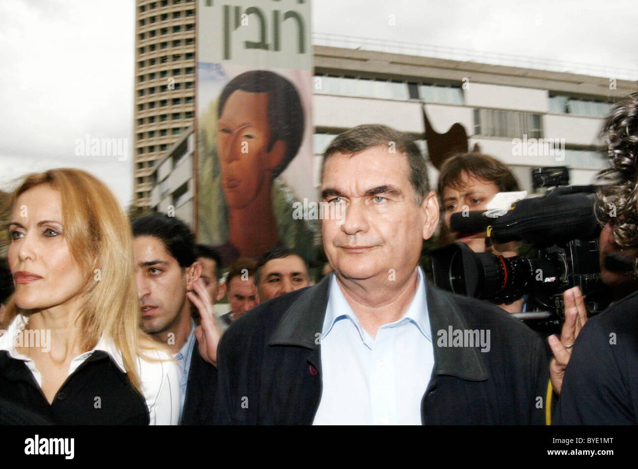 Former Israeli Justice Minister Haim Ramon leaves court with his ...