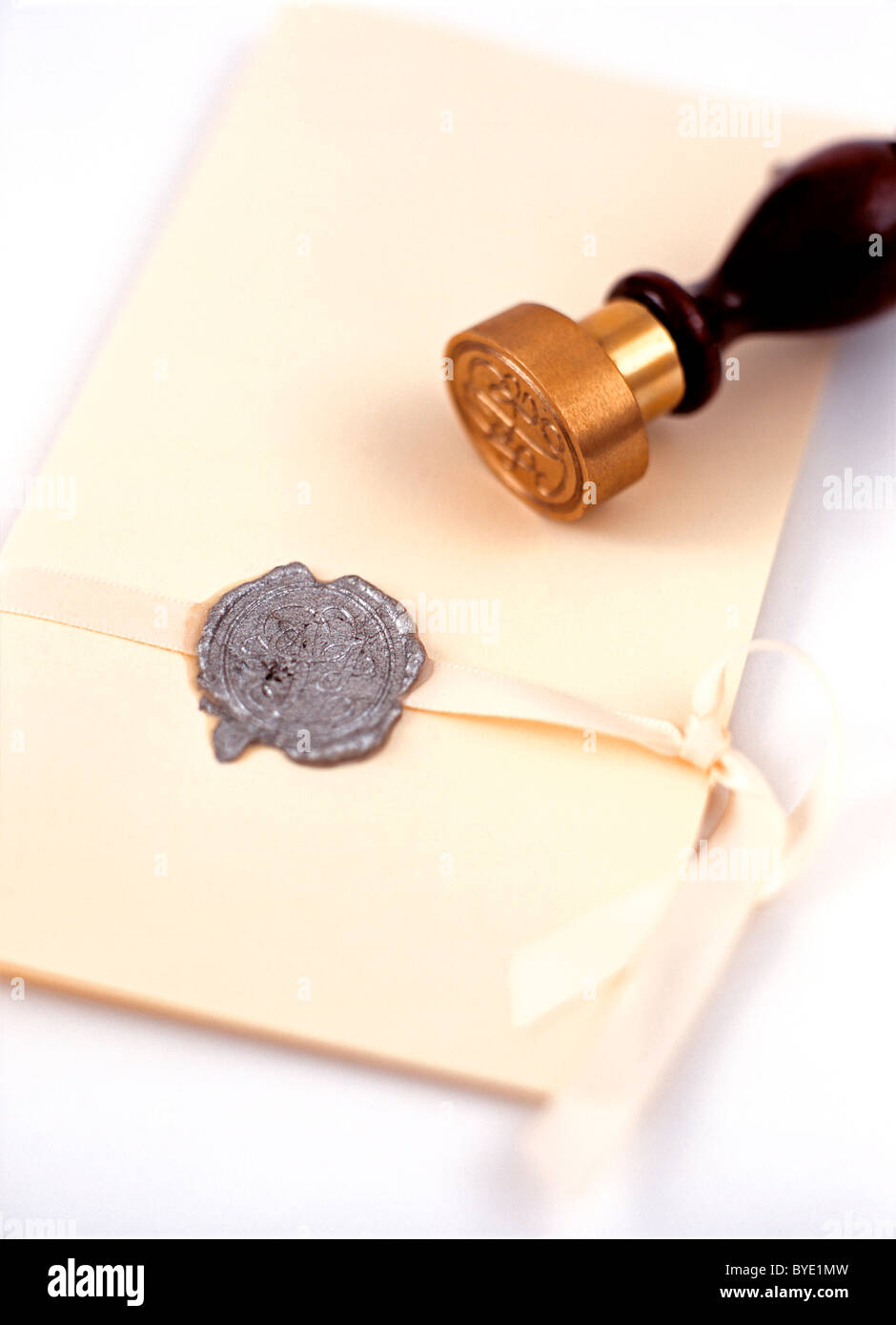 Envelope with a wax seal and a seal stamps, wedding Stock Photo - Alamy