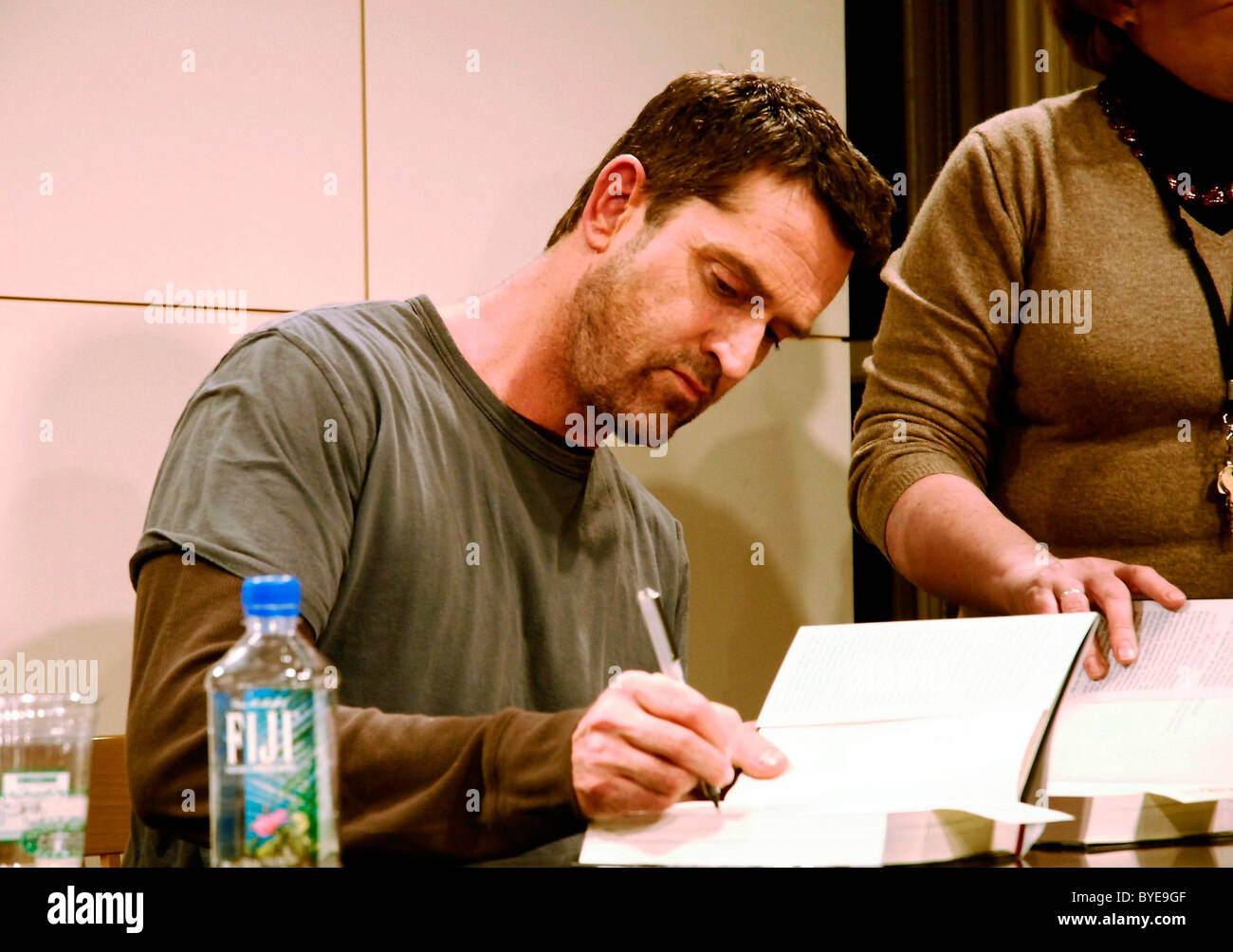 Rupert Everett signs copies of his new autobiography 'Red Carpet and ...