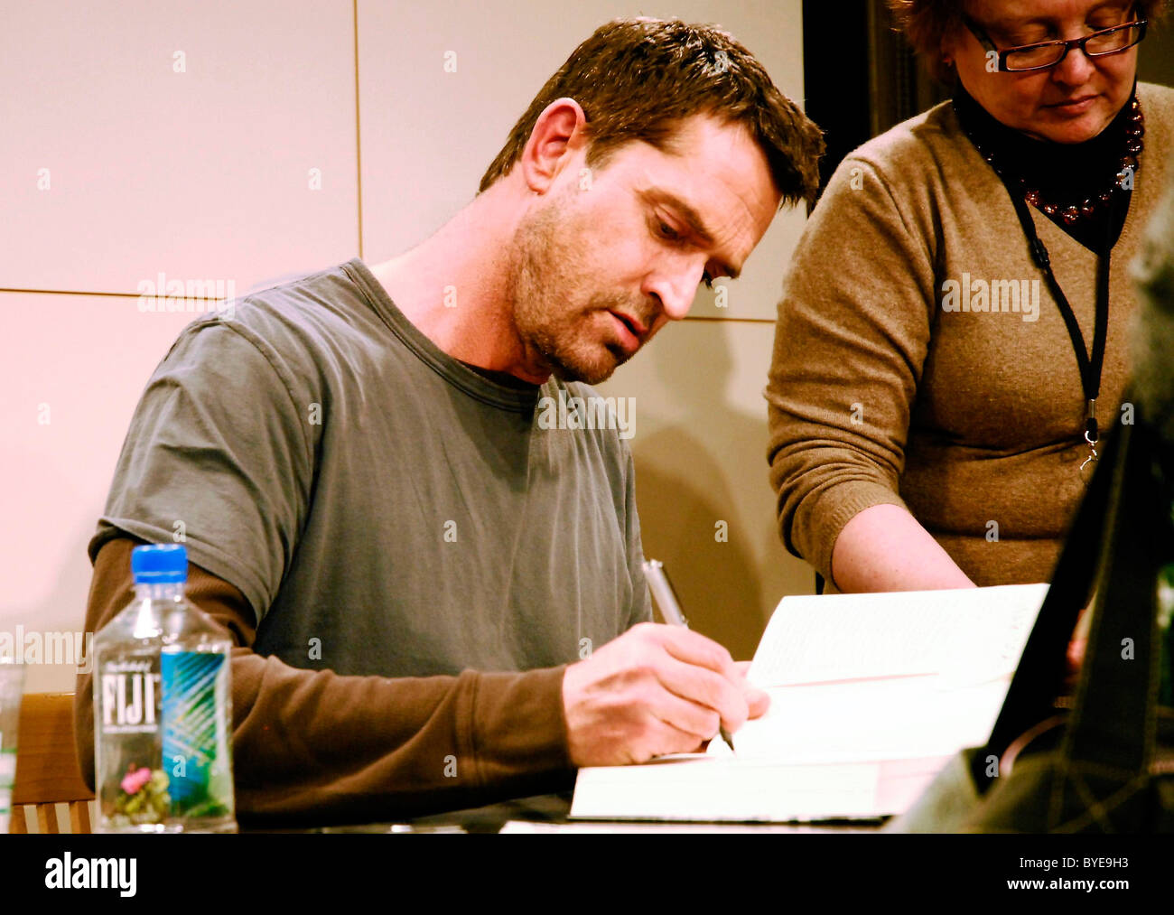 Rupert Everett signs copies of his new autobiography 'Red Carpet and ...