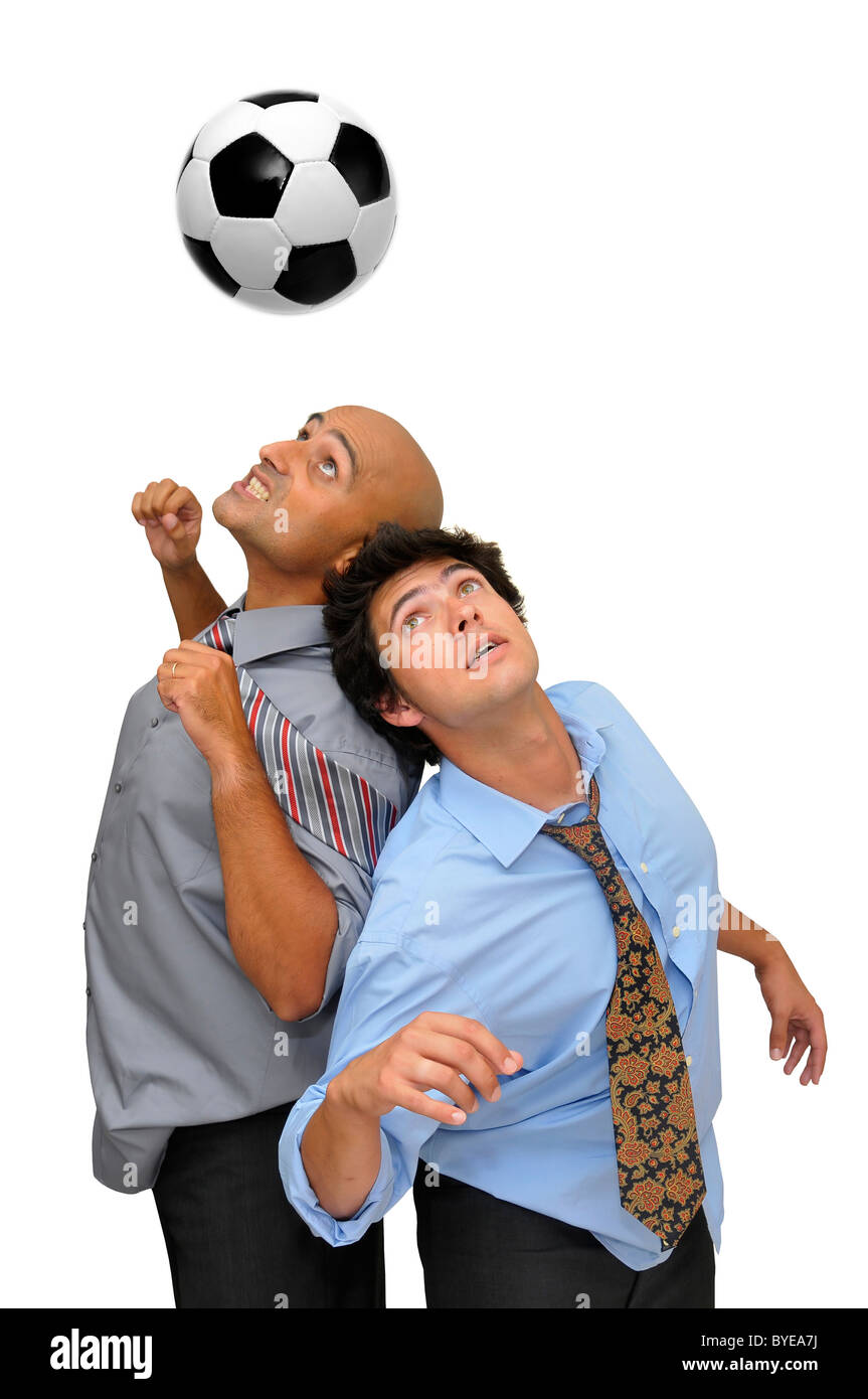 Two businessmen fighting in a soccer game isolated in white Stock Photo ...
