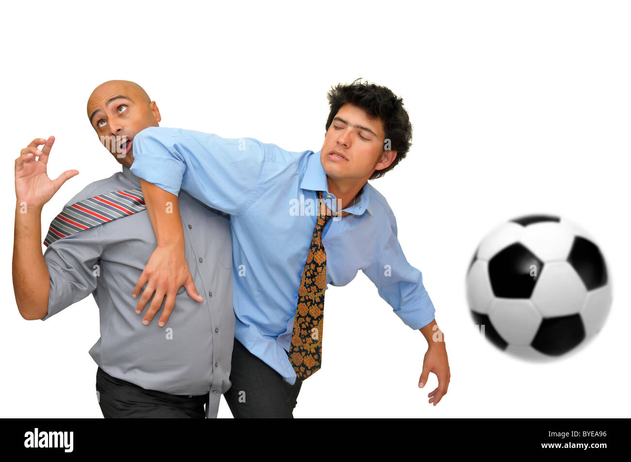 Two businessmen fighting in a soccer game isolated in white Stock Photo ...