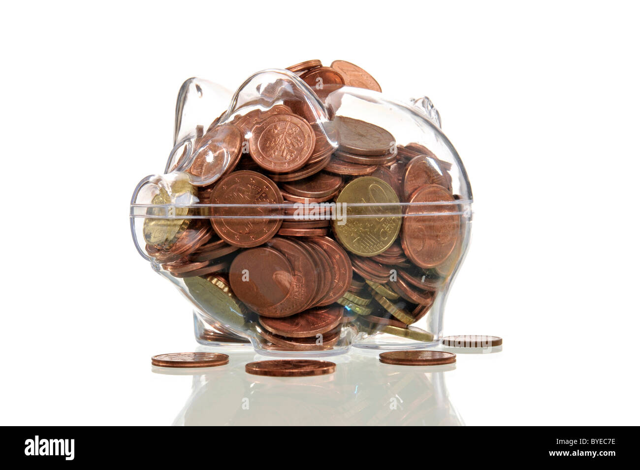 Over-filled transparent piggy bank, symbolic image for full coffers ...