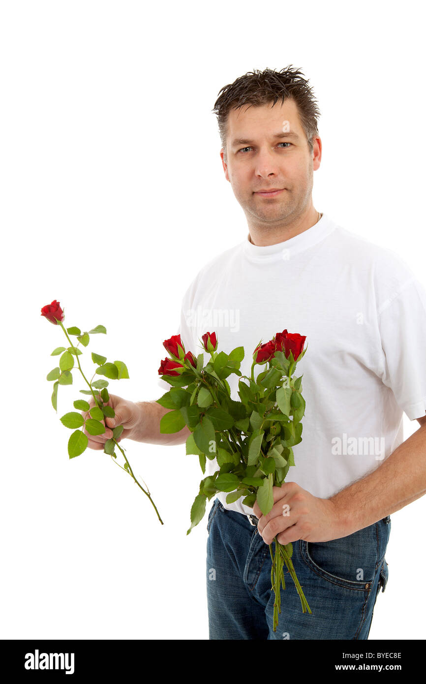 Handsome man with bouquet of roses isolated on white background Stock ...