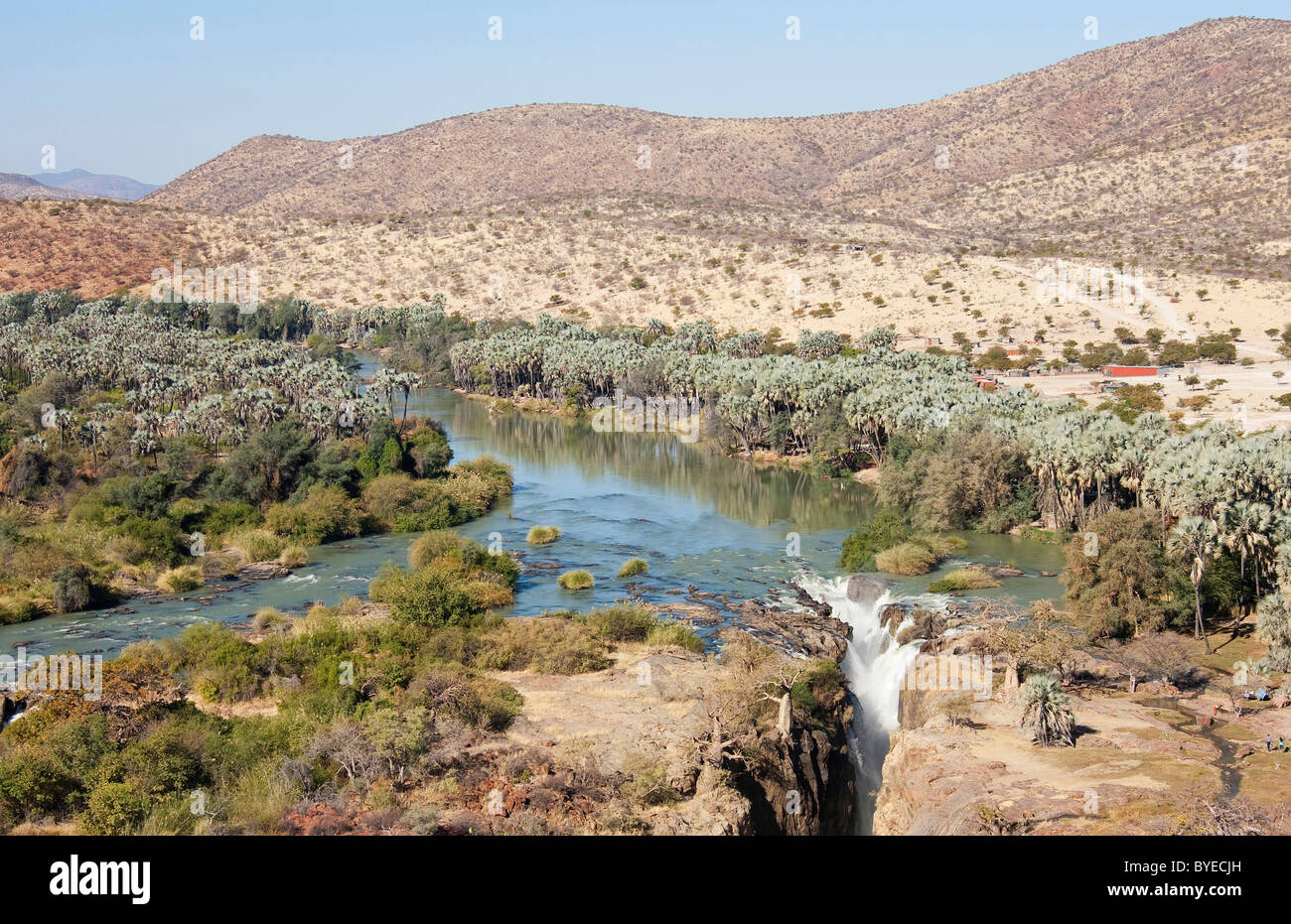 At the beautiful Epupa Falls the Kunene River drops in a series of ...