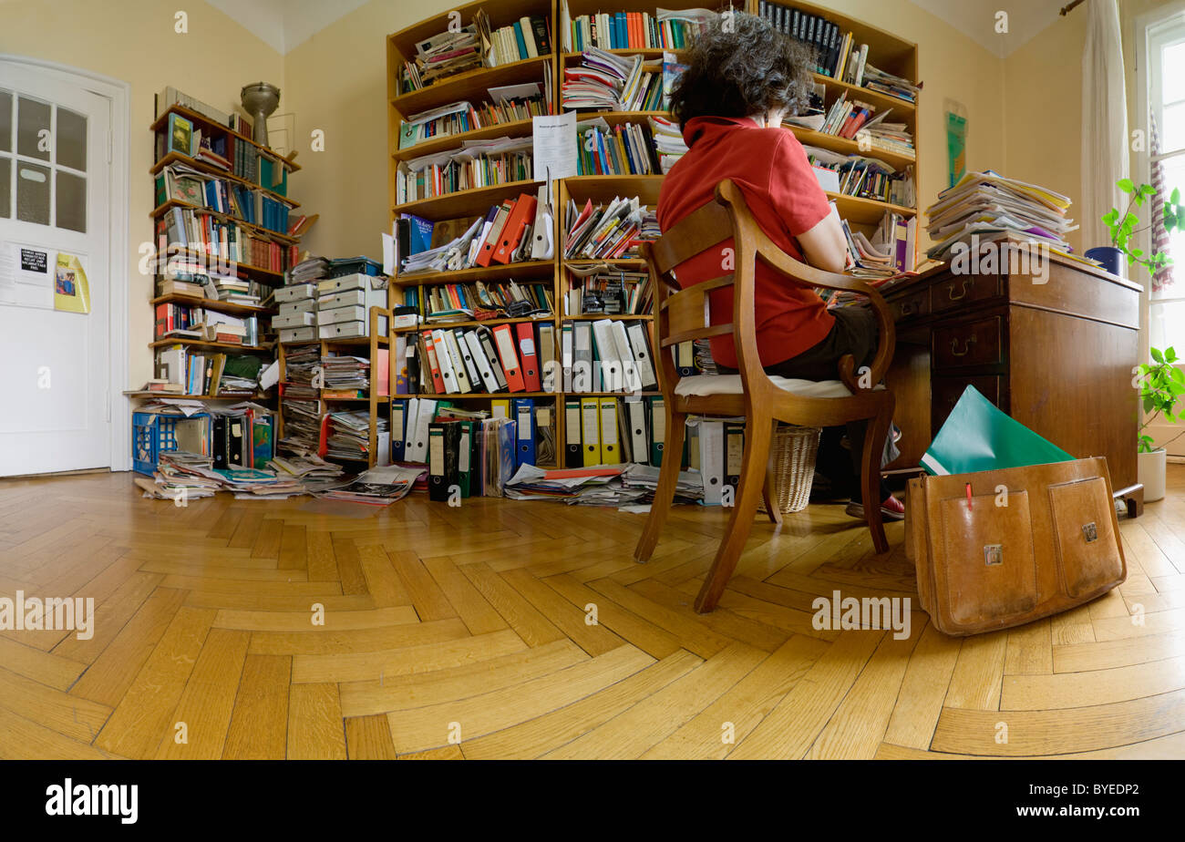 Teacher sitting at her desk in her office hi-res stock photography and ...