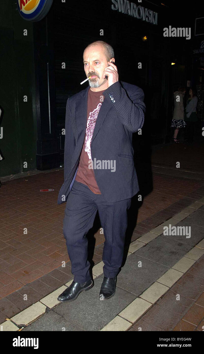 Keith Allen smoking and talking on his mobile when leaving Lillies ...