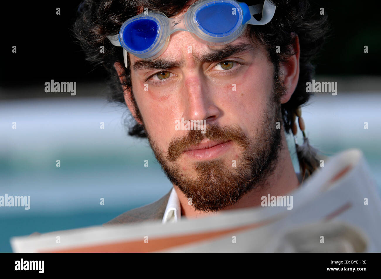 Newspaper poolside hi-res stock photography and images - Alamy