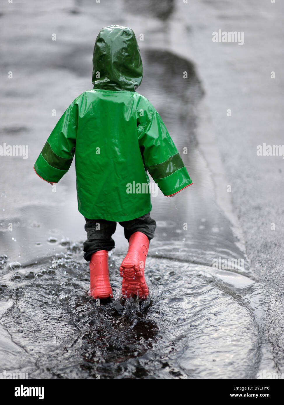 two year old boy playing in puddle Stock Photo - Alamy