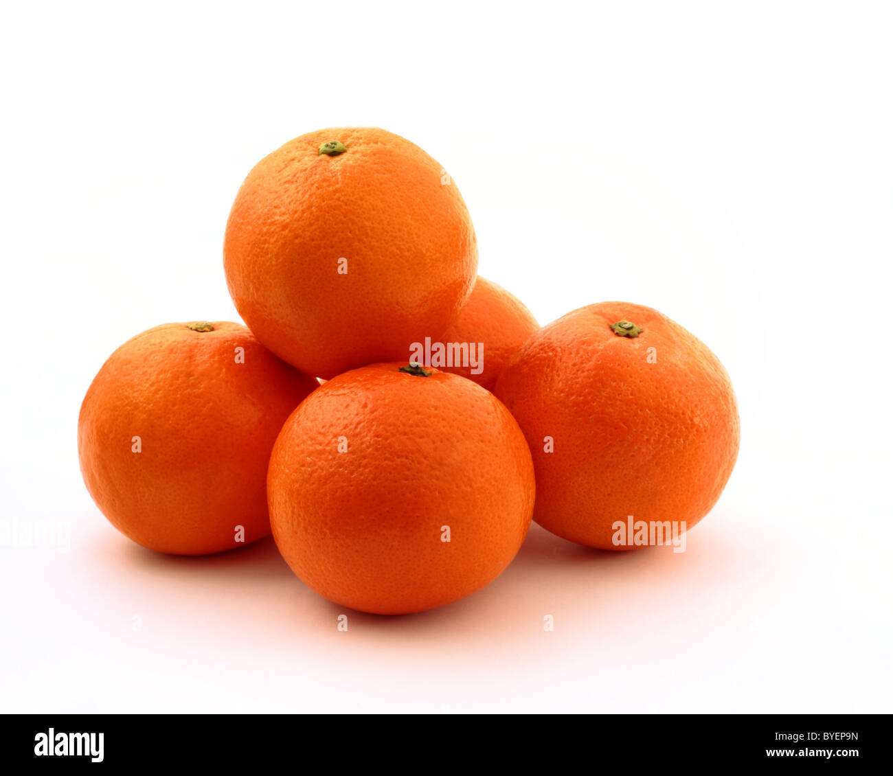 A stack of oranges on a white background Stock Photo - Alamy