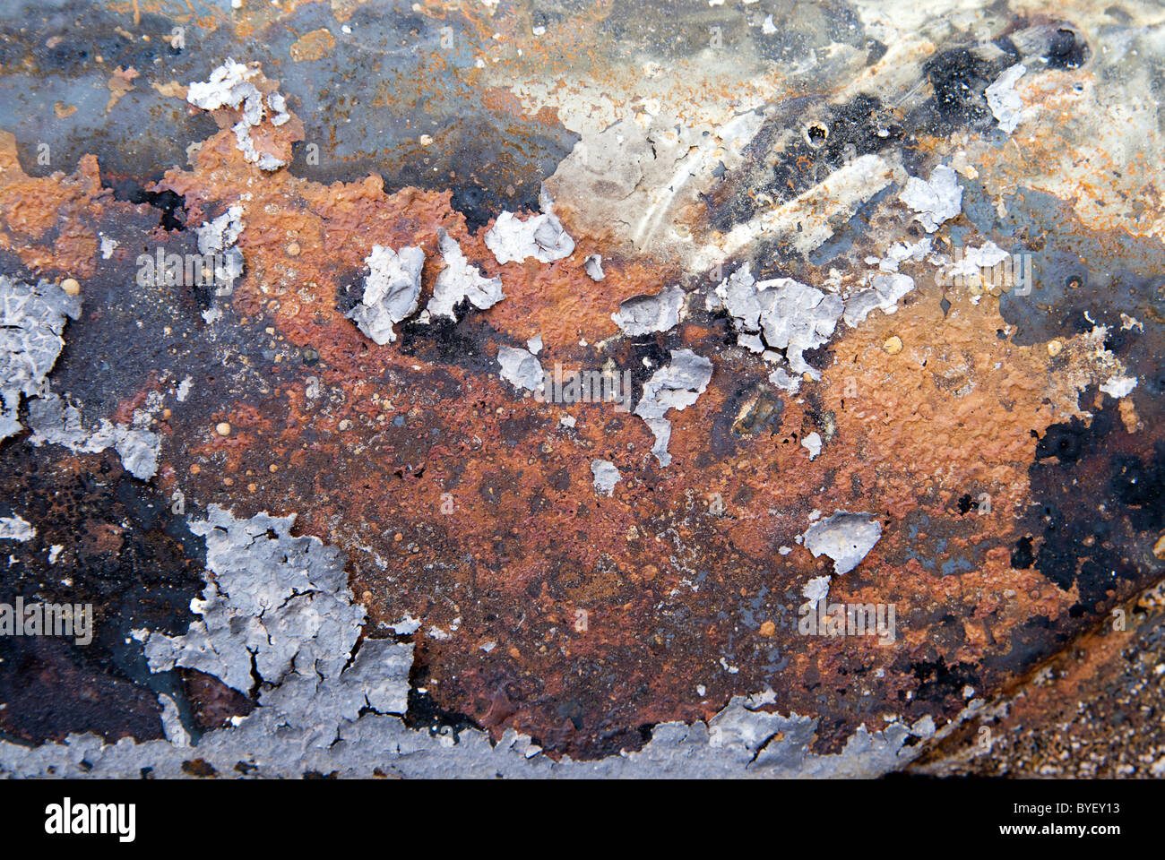 Burnt paint on a Mercedes van that had caught fire. There are flakes of ...