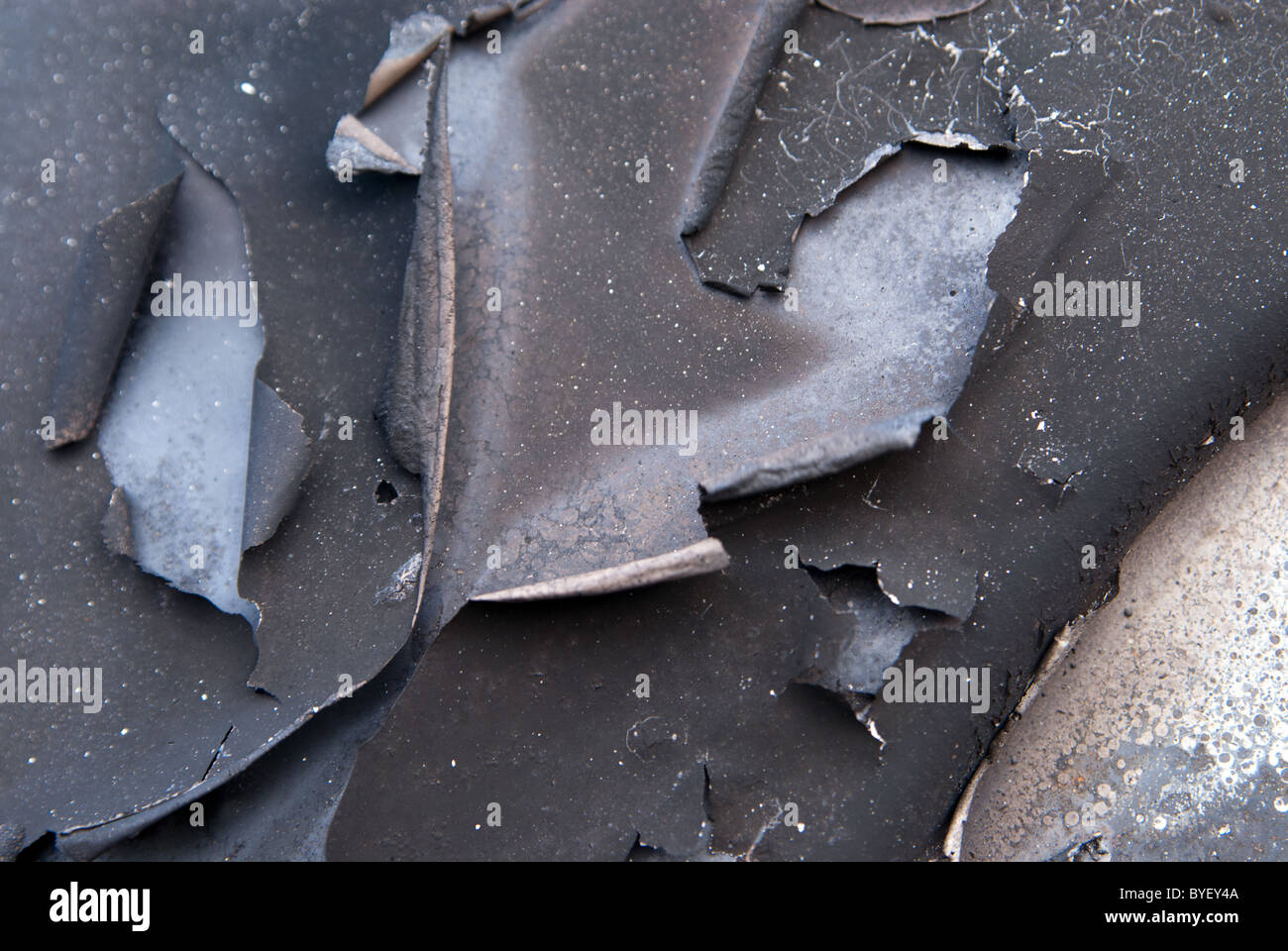 Burnt paint on a Mercedes van that had caught fire. There are flakes of ...