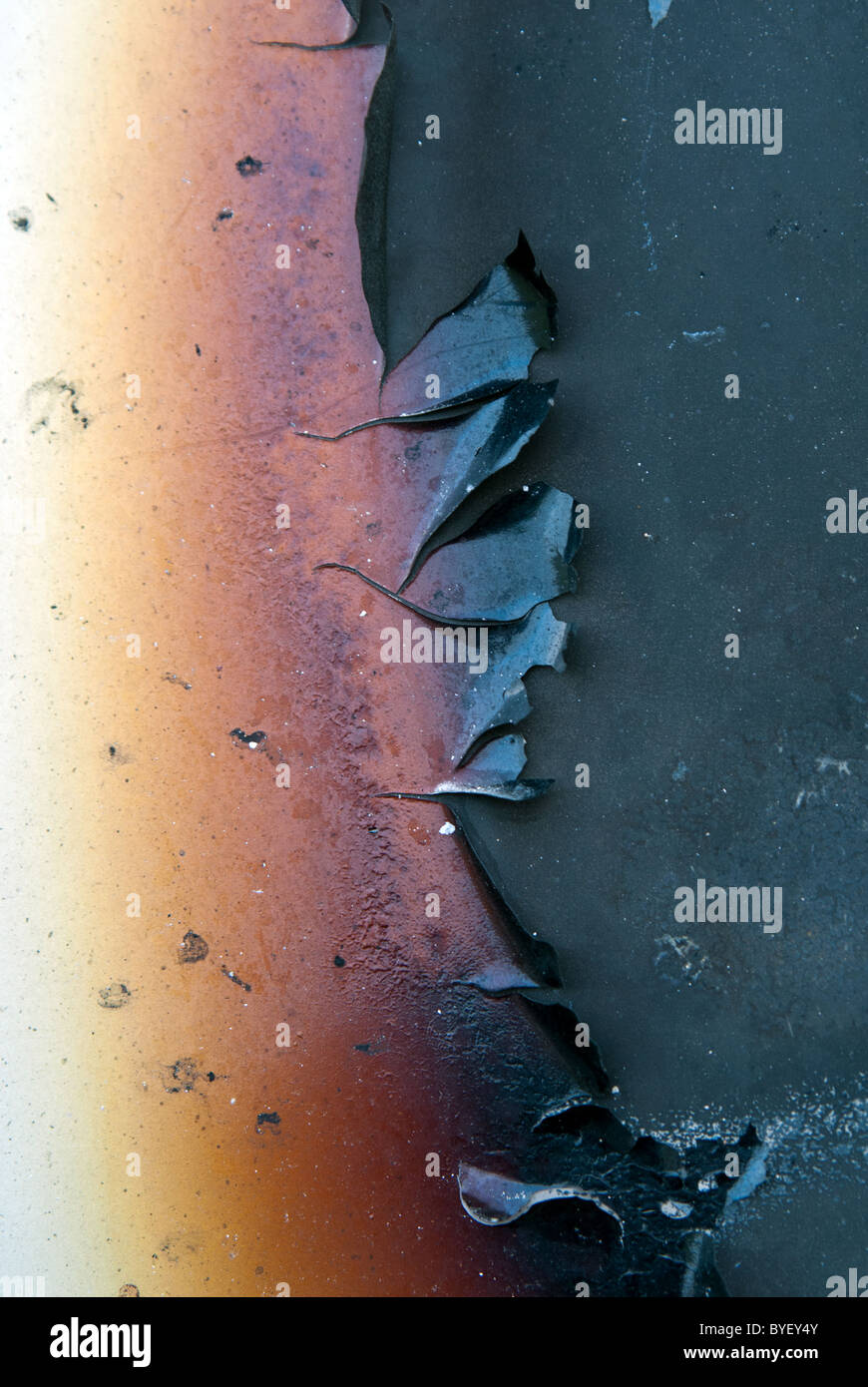 Burnt paint on a Mercedes van that had caught fire. There are flakes of ...