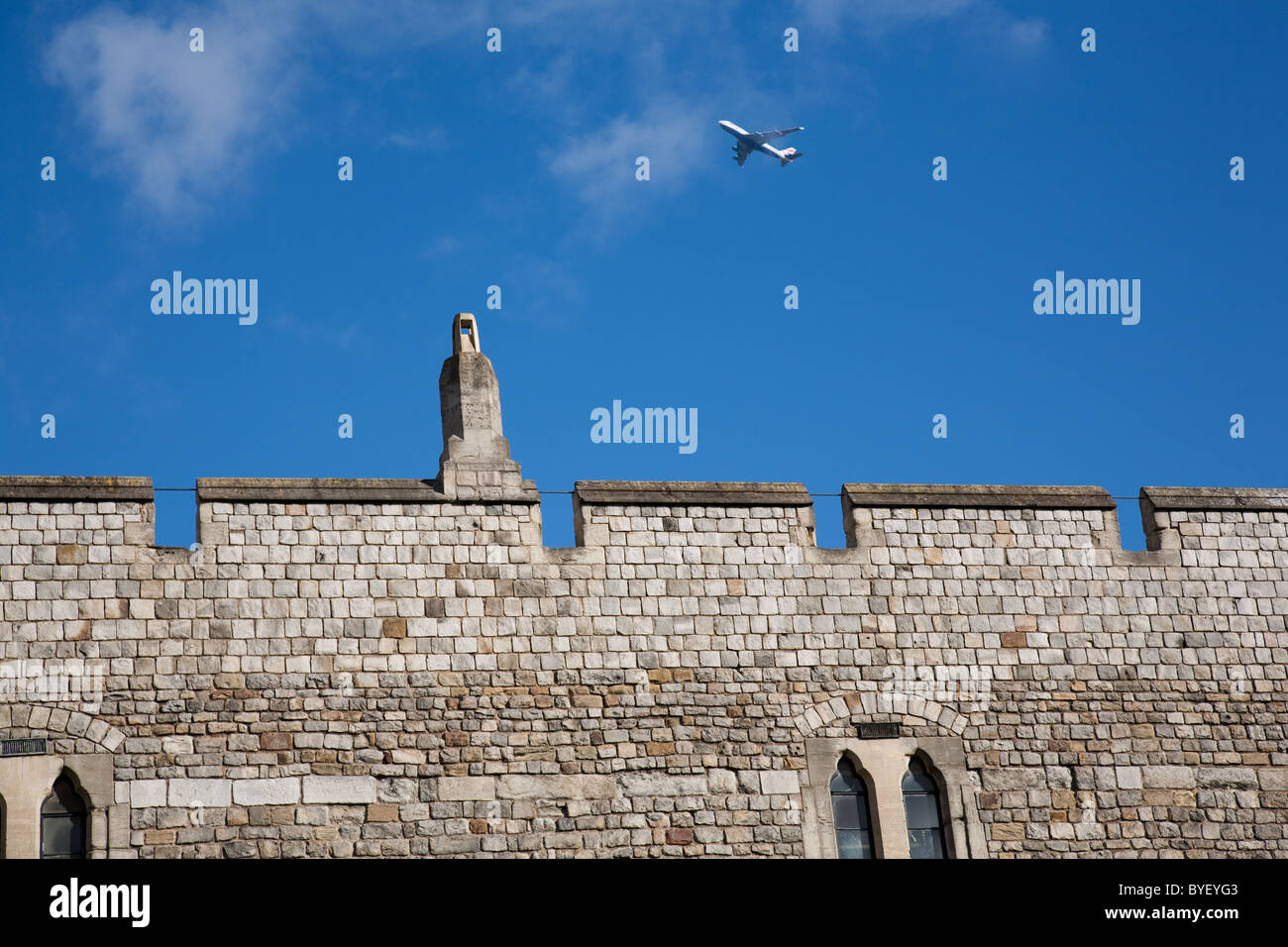 Aircraft over the turrets of Windsor Castle wall, Berks, UK Stock Photo ...