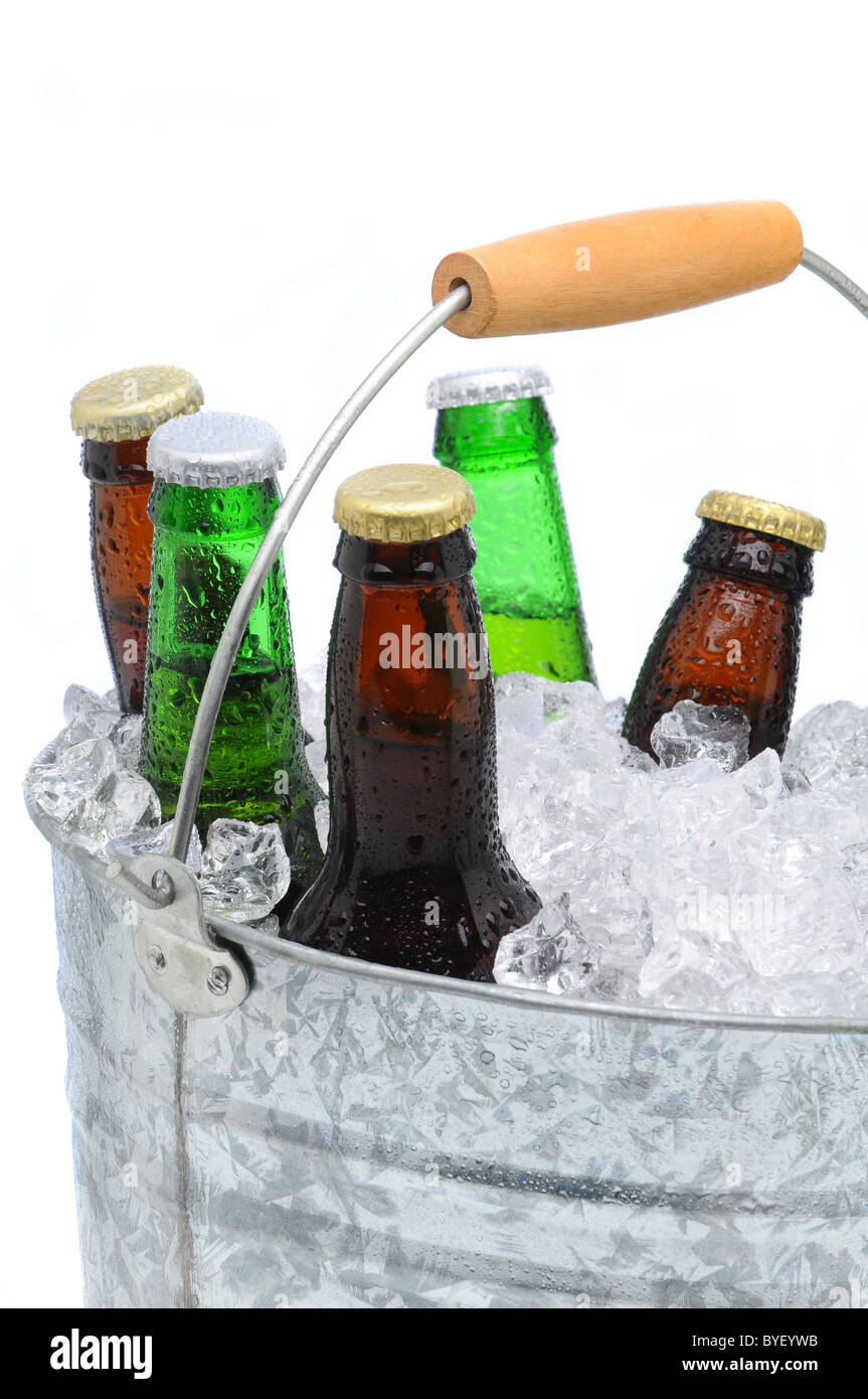 Closeup of a bucket filled with ice cubes and an assorted beer bottles ...