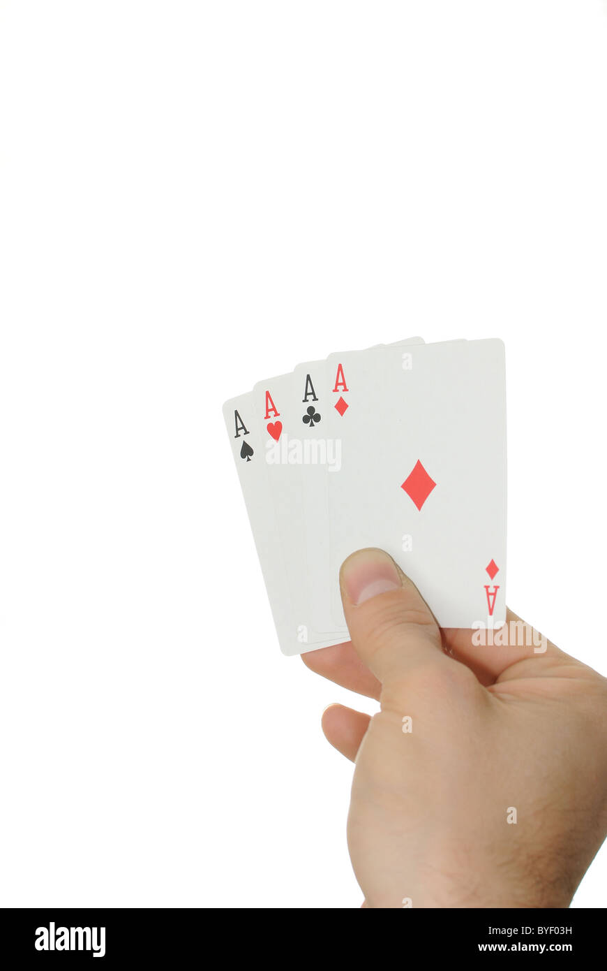 Four aces in a hand isolated on a white background Stock Photo - Alamy
