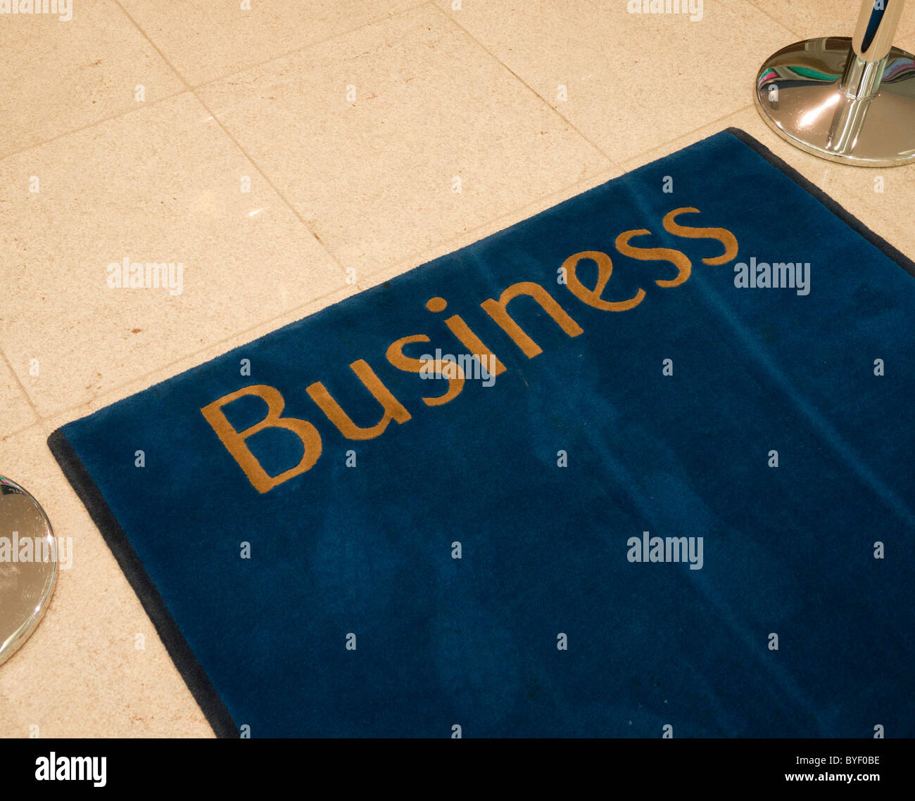 Business class carpet at check-in Stock Photo - Alamy