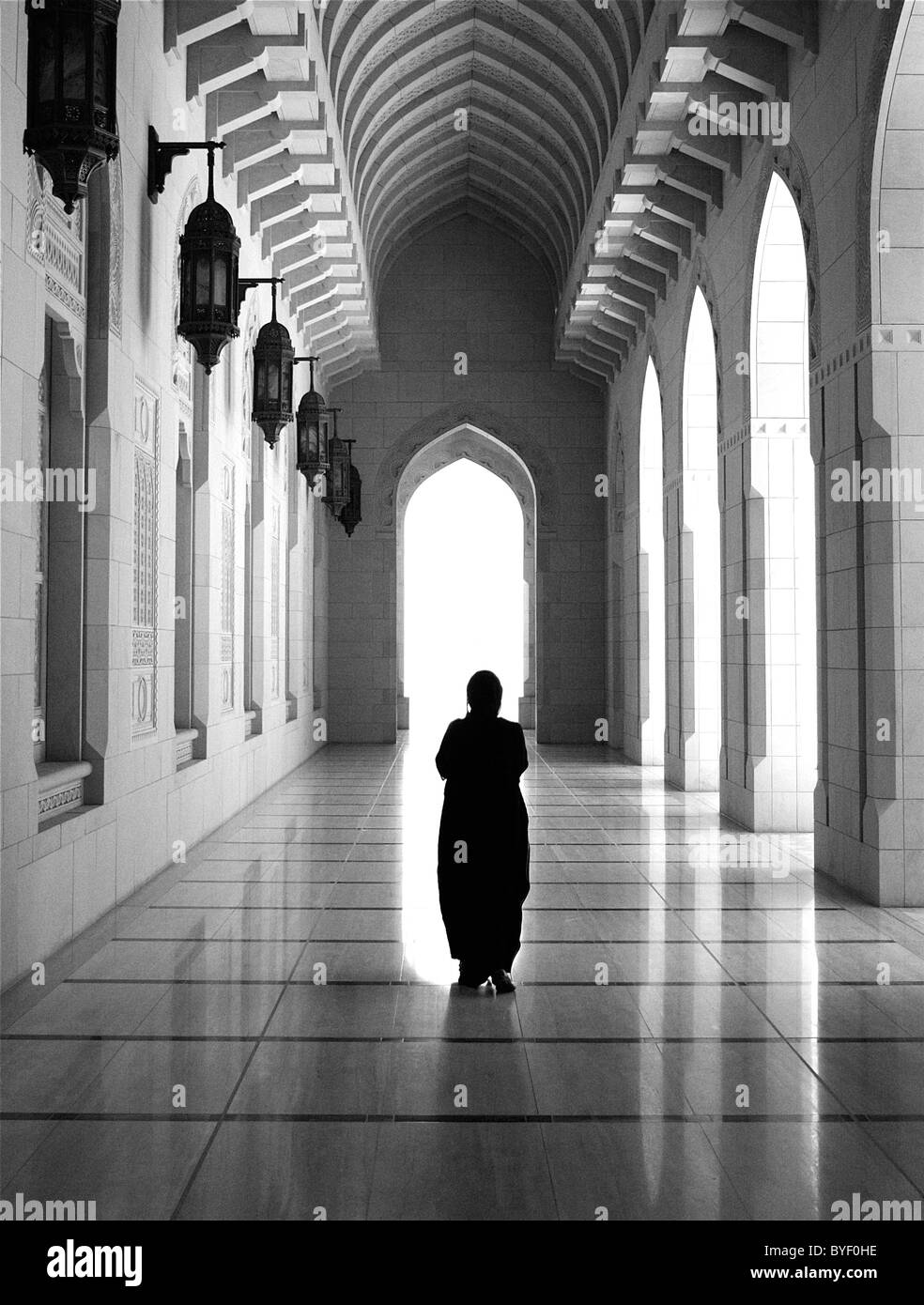 Islamic figure seen in silhouette in cool building Stock Photo - Alamy