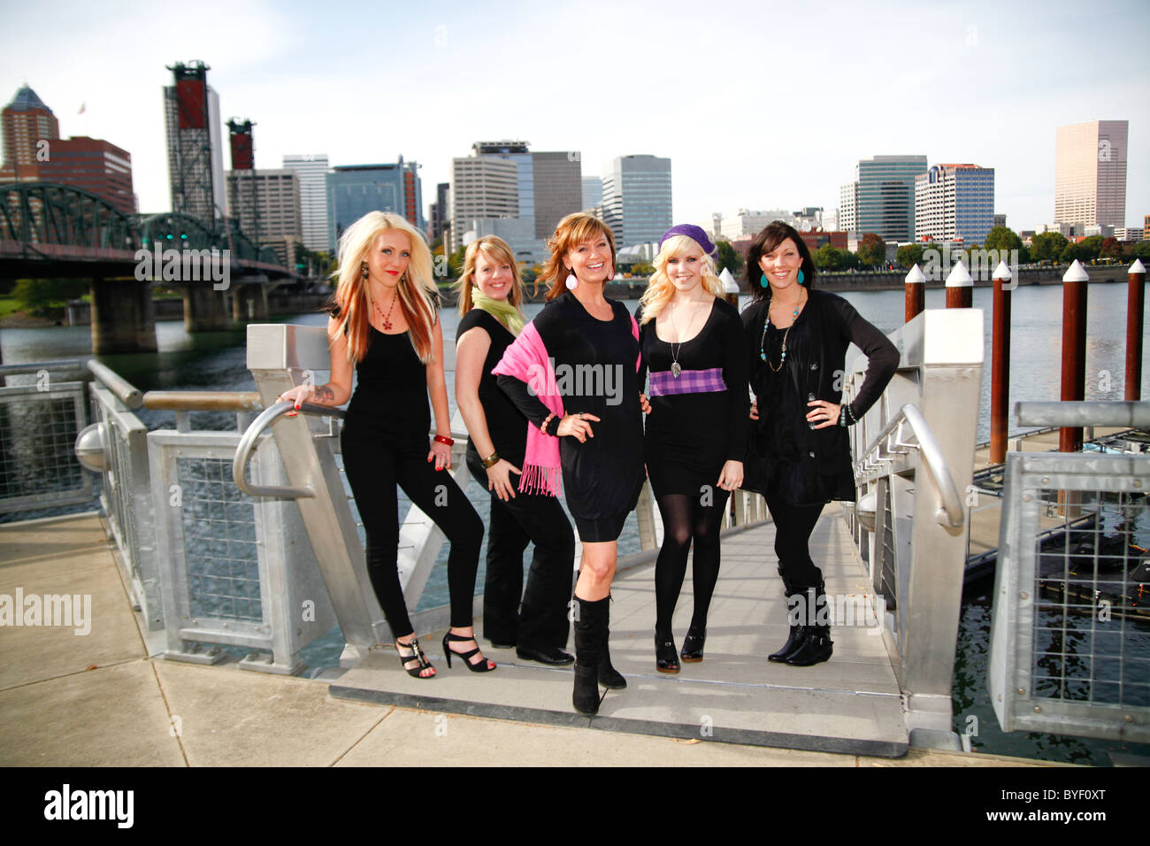 Group of beautiful women on a riverfront cityscape Stock Photo - Alamy