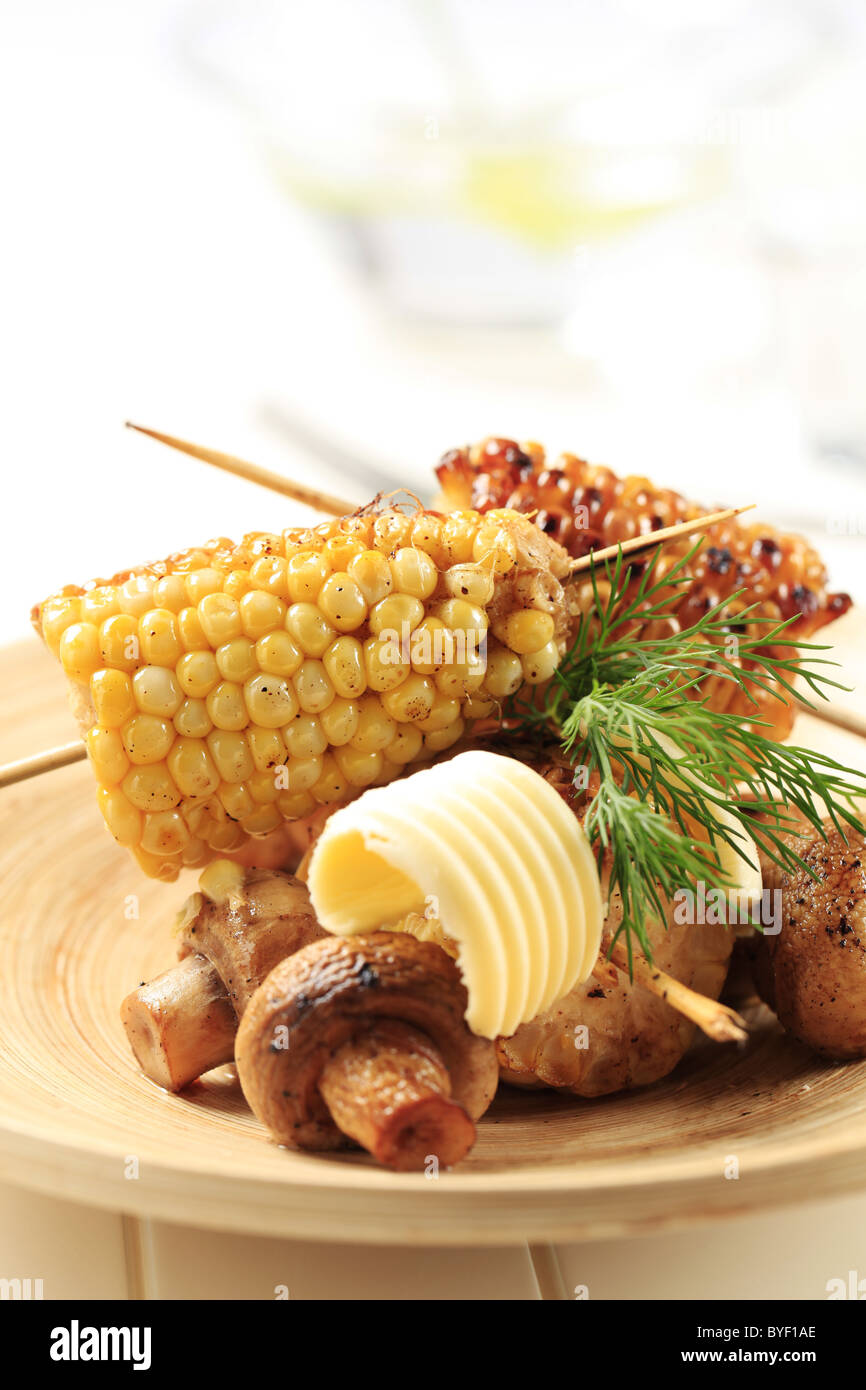 Roasted sweet corn cobs and button mushrooms Stock Photo - Alamy