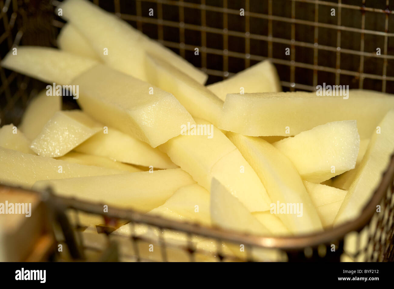raw sliced cut home made chips from fresh potatoes Stock Photo - Alamy