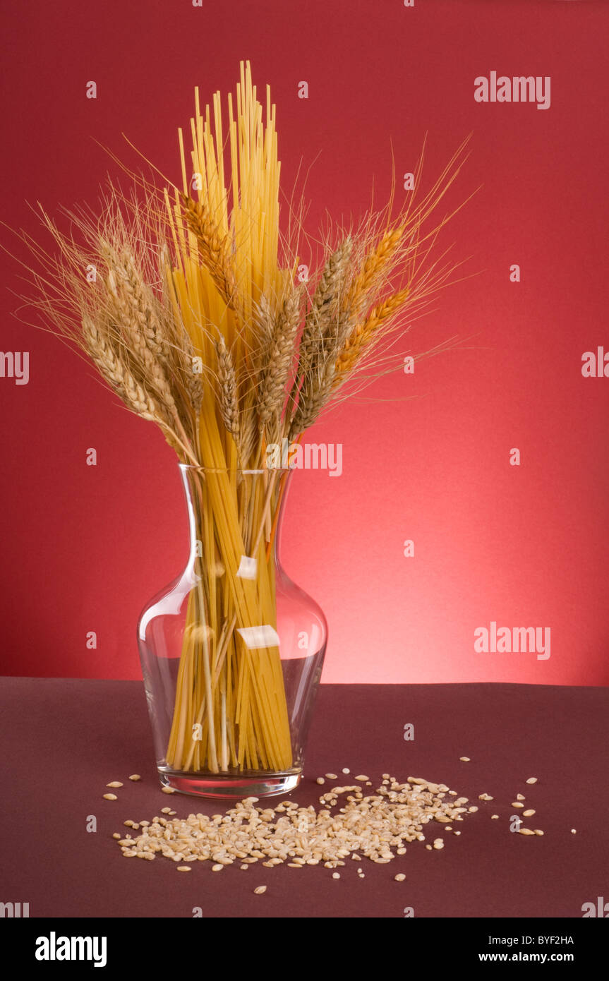 Pasta, wheat cereals, whole grains on a red background Stock Photo - Alamy