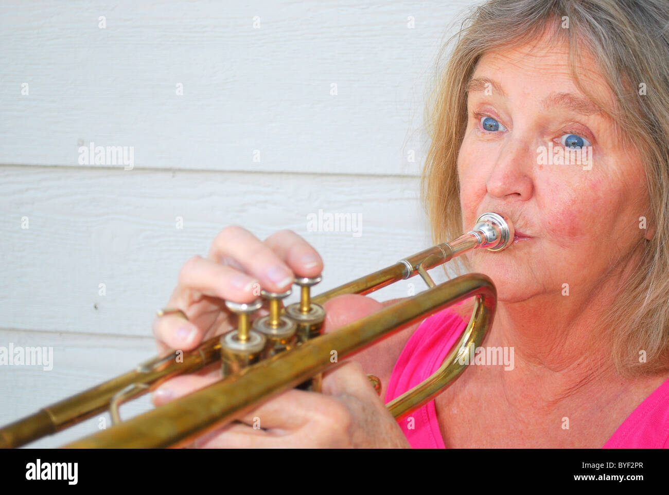 Blowing an instrument hi-res stock photography and images - Alamy