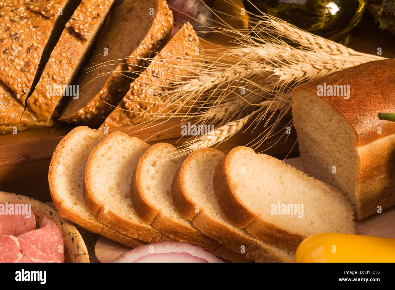 Bread food on a wood kitchen board close-up Stock Photo - Alamy